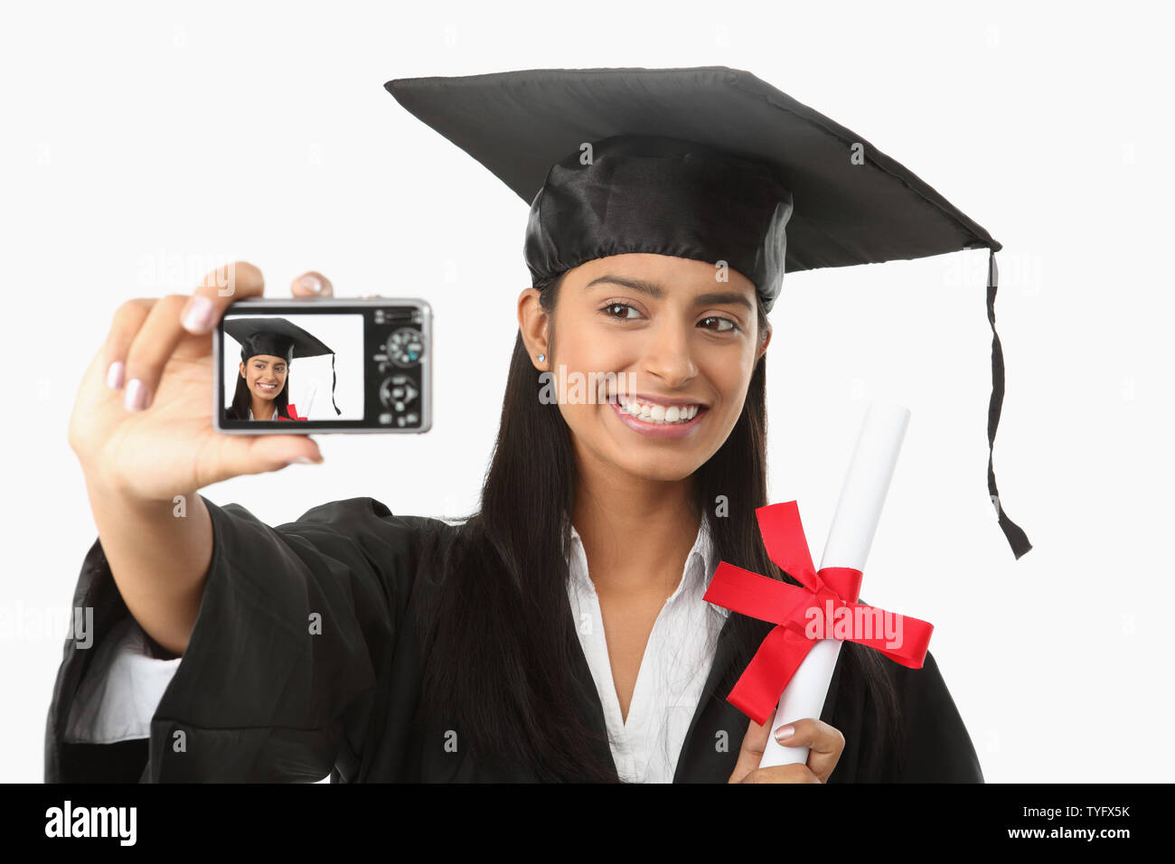 University student holding graduation degree Stock Photo - Alamy