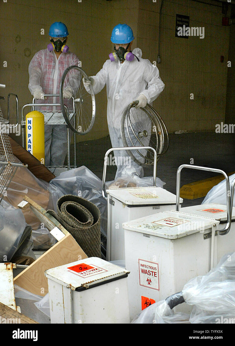 Workers discard wheelchair wheels from Tulane University Hospital in ...
