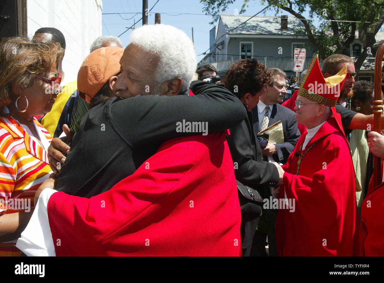 The Rev. Jerome LeDoux greets parishioners at St. Augustine Catholic ...