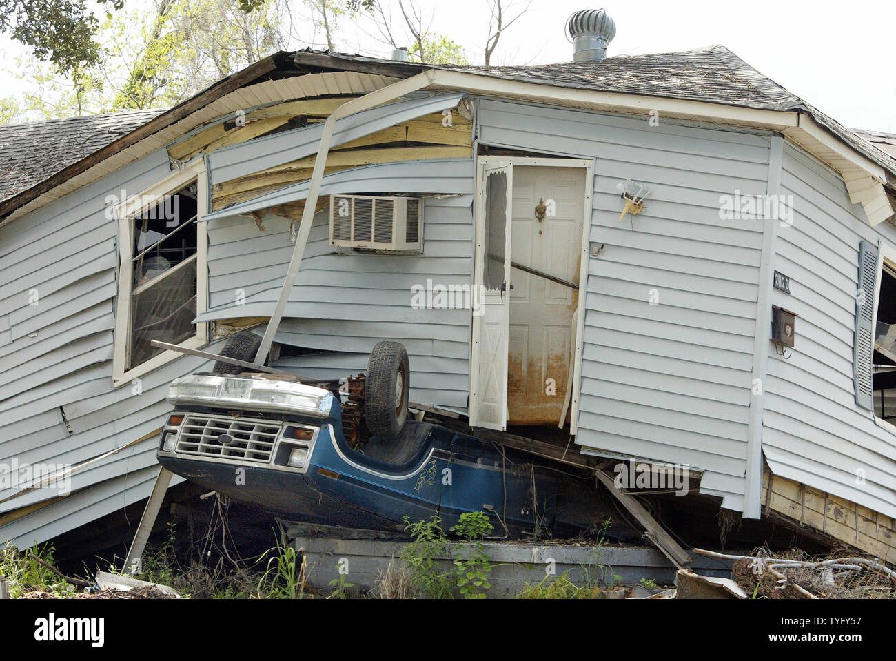 A house rests atop a car in the Lower 9th Ward in New Orleans August 27 ...
