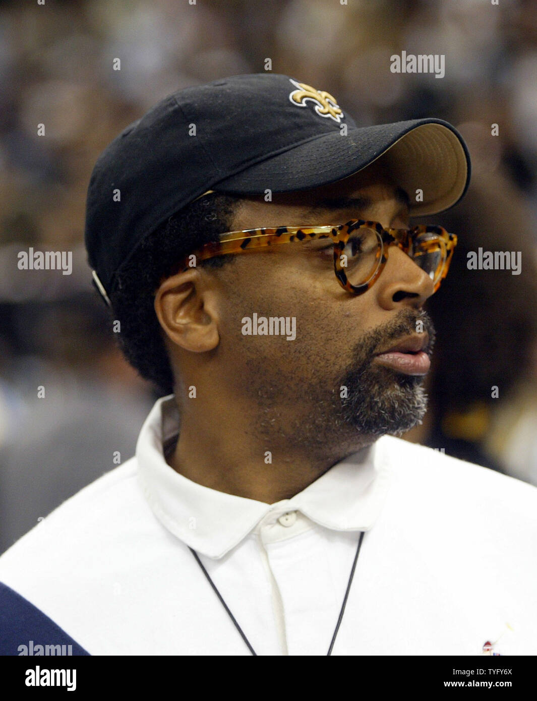 Spike Lee, wearing a Saints cap, stands on the sidelines during the New ...