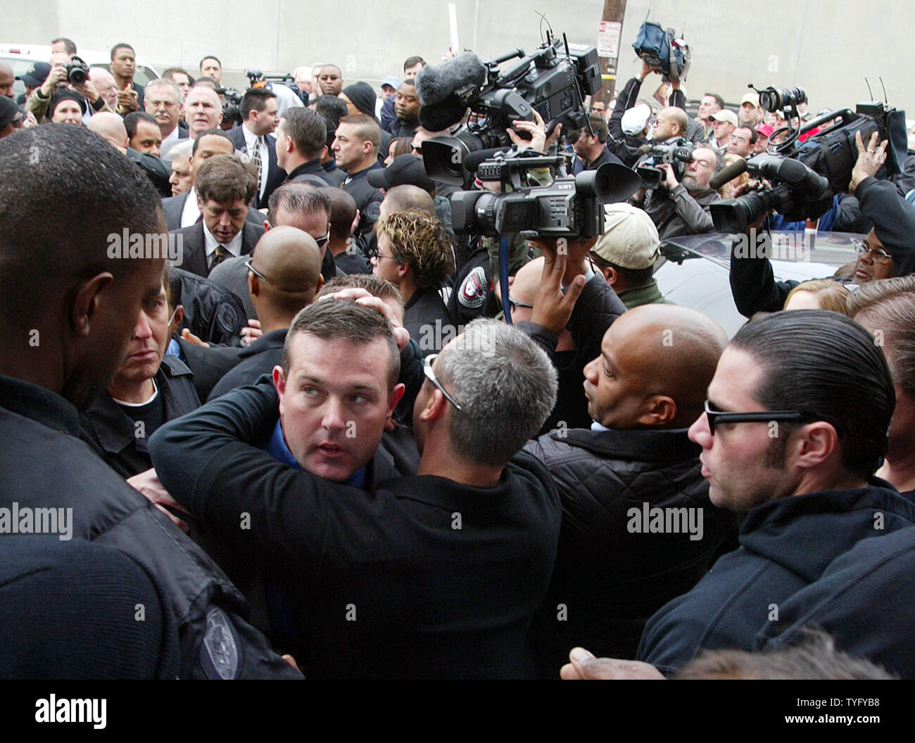 Sgt. Robert Gisevius Jr., second from left is hugged by a fellow police ...