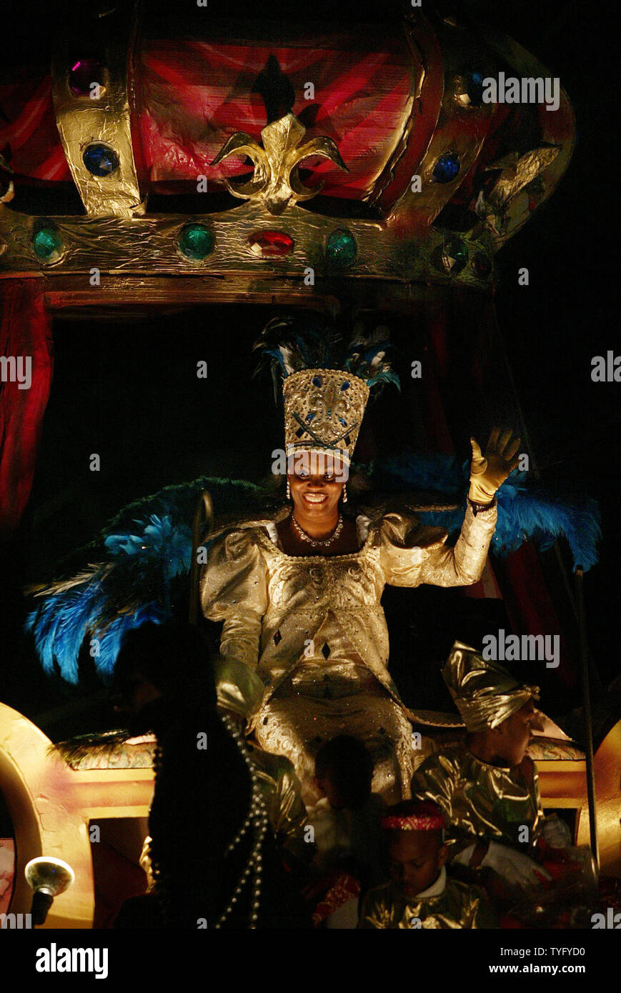 Portraying Queen Oshun and riding beneath the fleur-de-lis symbol of ...