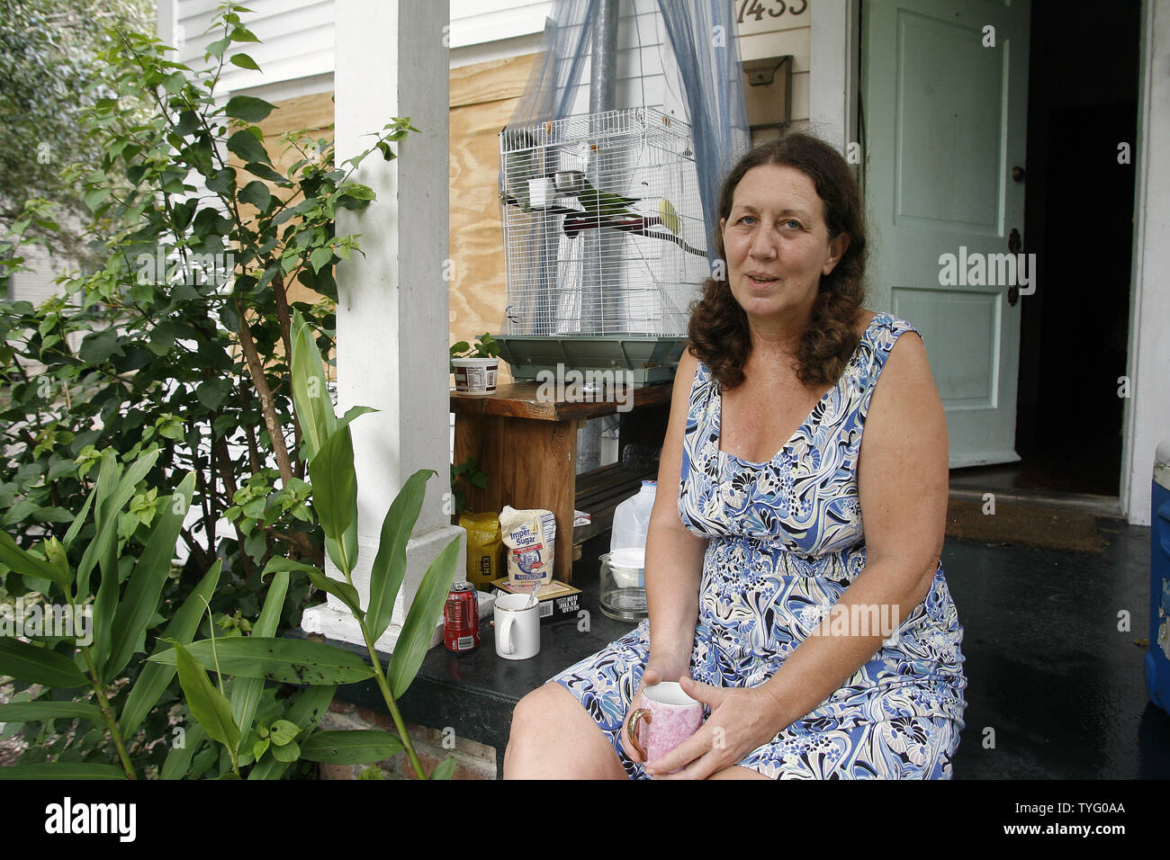 Sharon Spahn tries to beat the heat by sitting on her porch in uptown ...