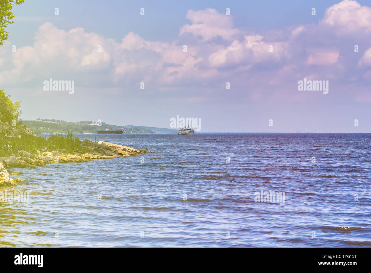 Cargo barge and pleasure craft on the fairway of the river. River ...
