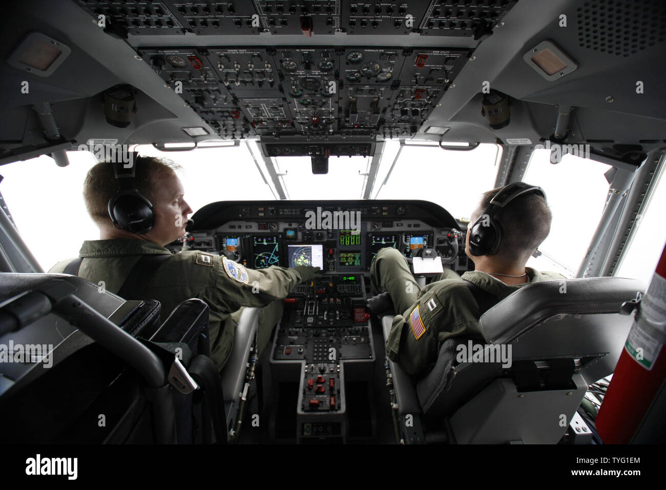 Coast Guard Lt. Andy Greenwood, left, and Lt. Peter Igoe pilot an HC ...