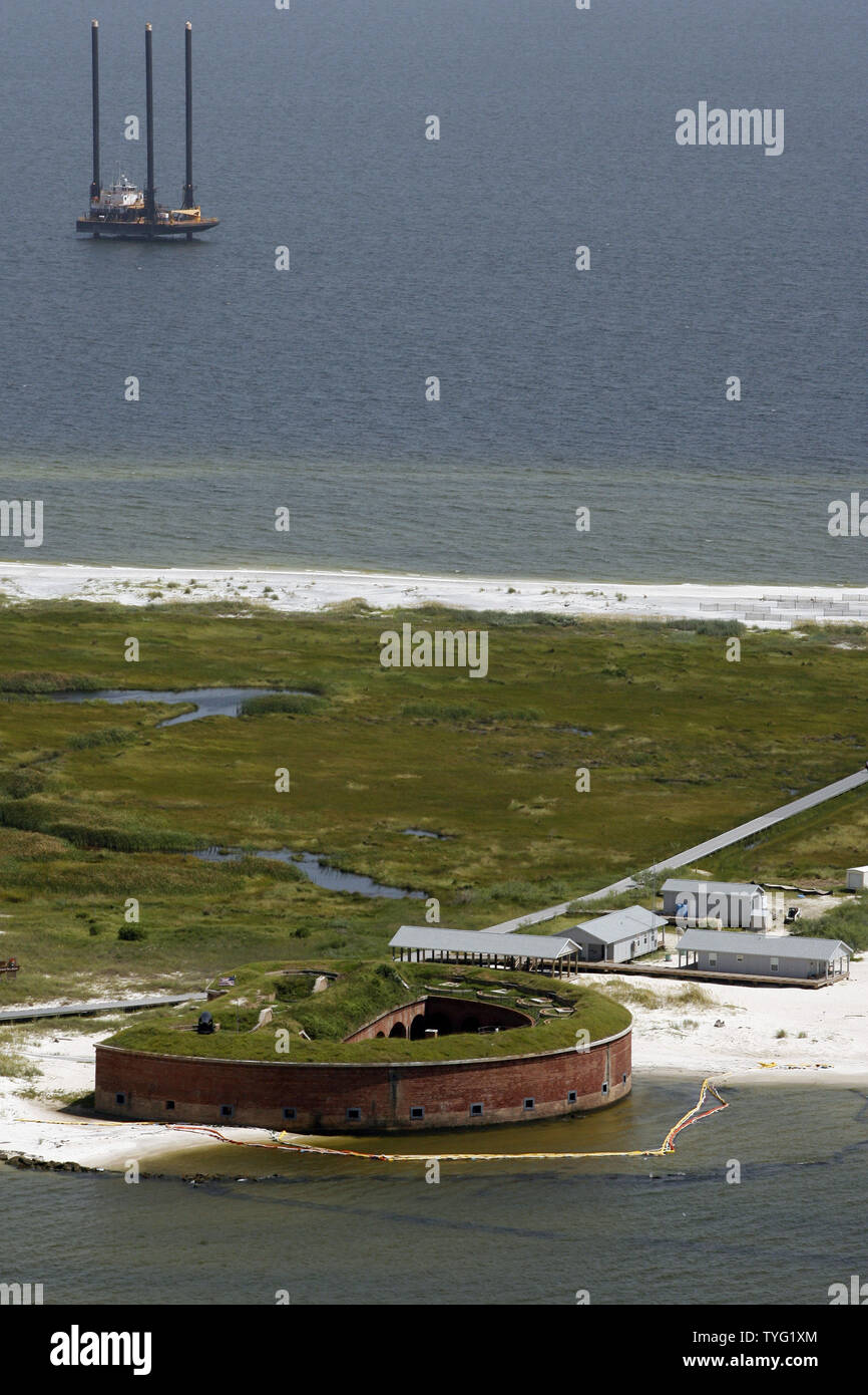 Fort Massachusetts, foreground, begun in 1859, looks out from East Ship ...