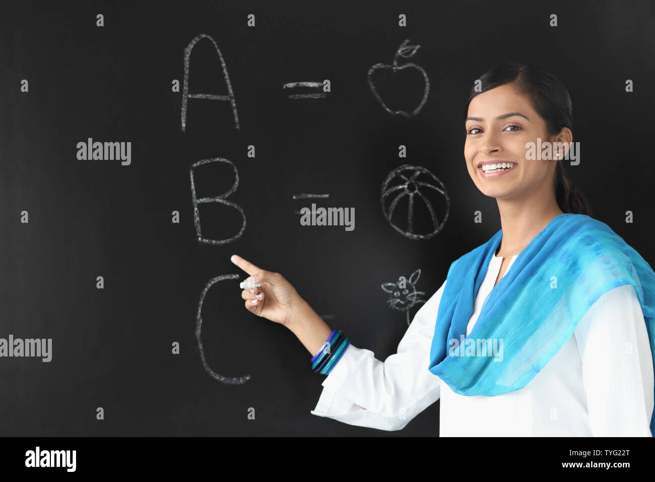 Teacher teaching in a classroom Stock Photo - Alamy
