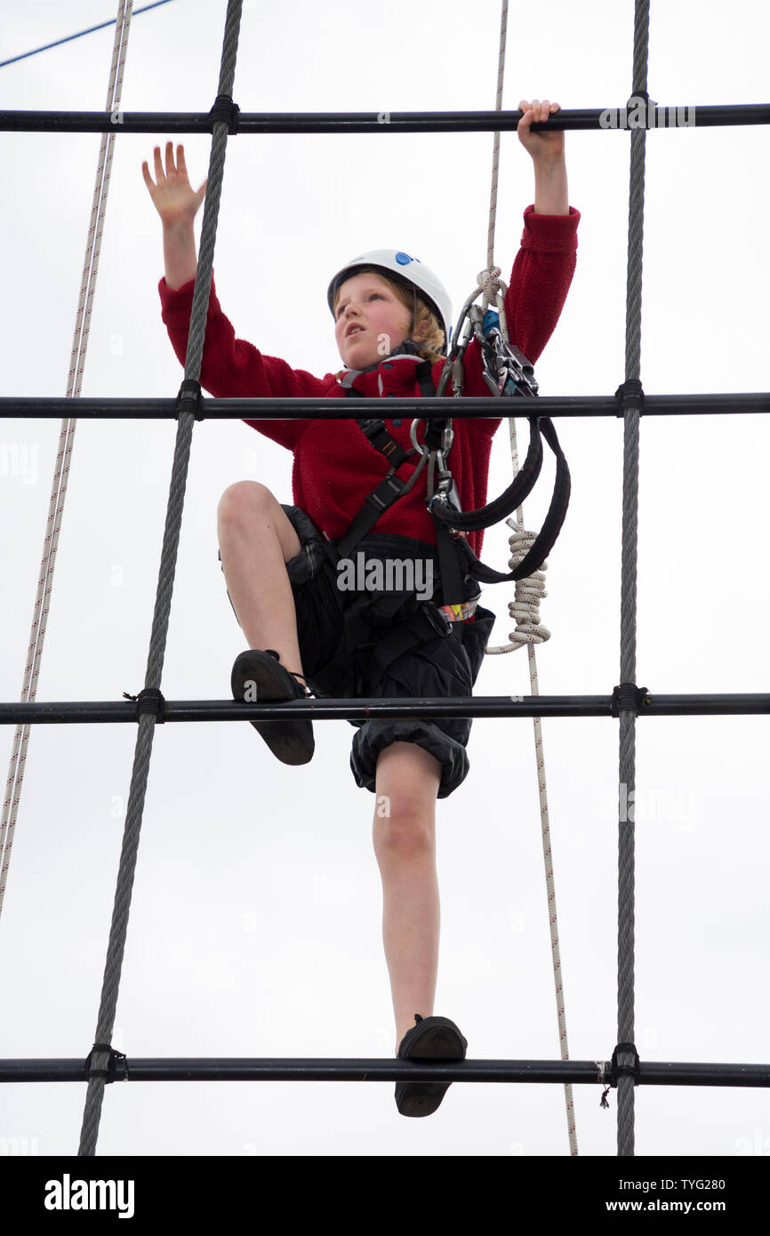 Girl / child / kid climbs / climbing the rigging and ropes of the SS ...