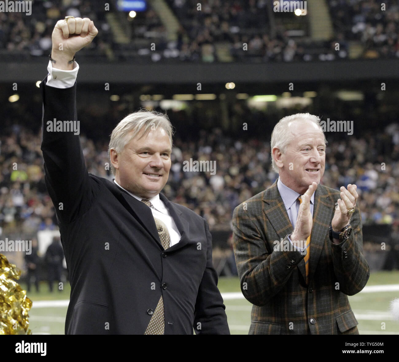 With Saints former quarterback Archie Manning standing by his side, Morten Andersen, (L) the ...