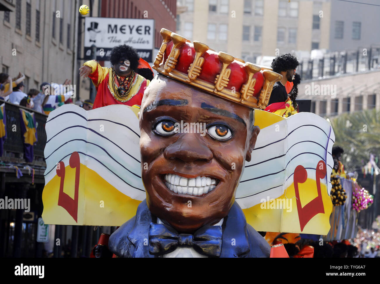 Float riders in the Zulu parade tosses beads to the crowd on St Charles ...