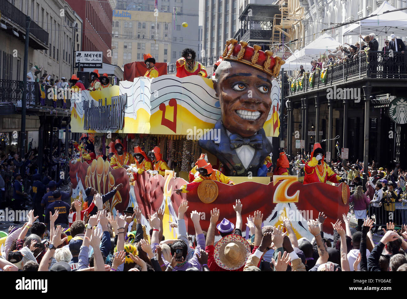 Float riders in the Zulu parade tosses beads to the crowd on St Charles ...