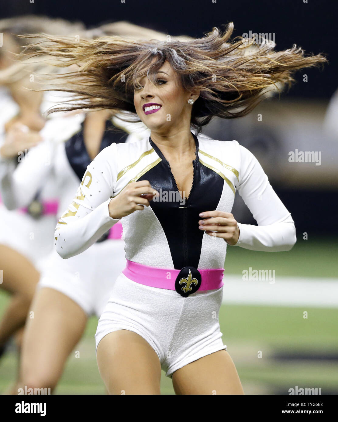 A New Orleans Saints Cheerleader Entertains The Crowd During A Break In The Game With The