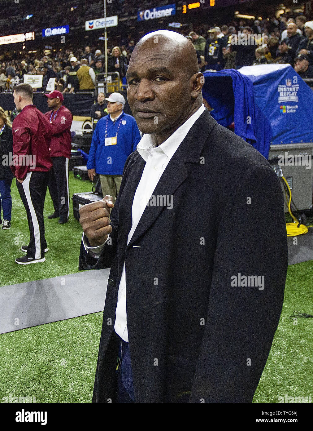 Heavyweight champion Evander Holifield visits the field before the NFC ...