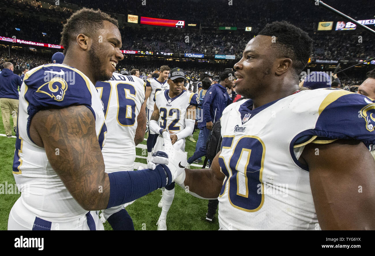 Los Angeles Rams defensive lineman John Franklin-Myers, left, ad ...