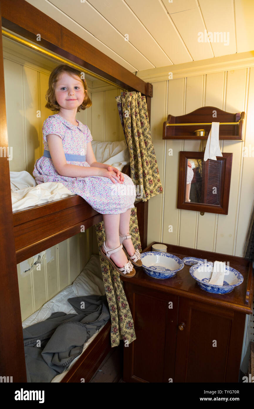 Young child girl / kid aged four, in a cabin room / cabin rooms ...
