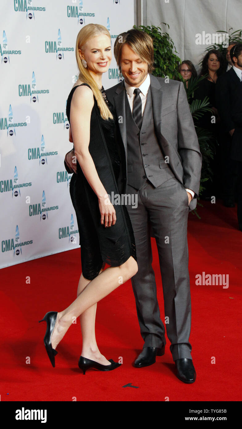 Keith Urban (R) and wife Nicole Kidman arrive on the red carpet at the 42nd annual Country Music ...