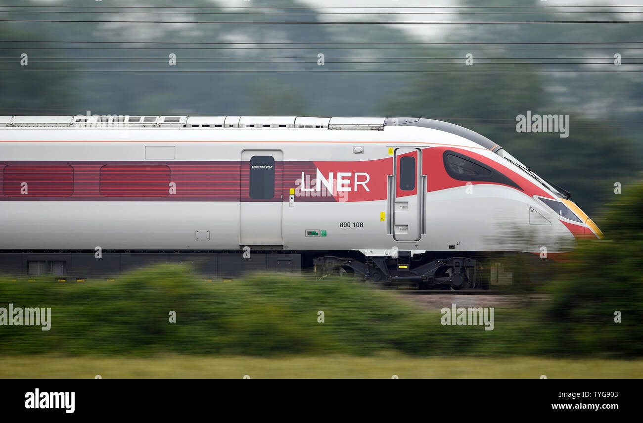 A London North Eastern Railway (LNER) Azuma train train passes through Sandy in Cambridgeshire ...