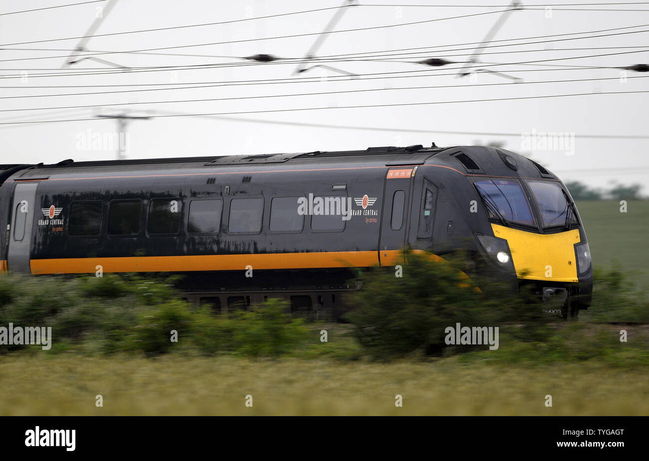 A Grand Central train passes through Sandy in Cambridgeshire Stock ...