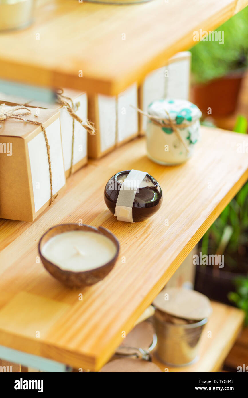 Scented candles standing on a wooden shelf Stock Photo - Alamy