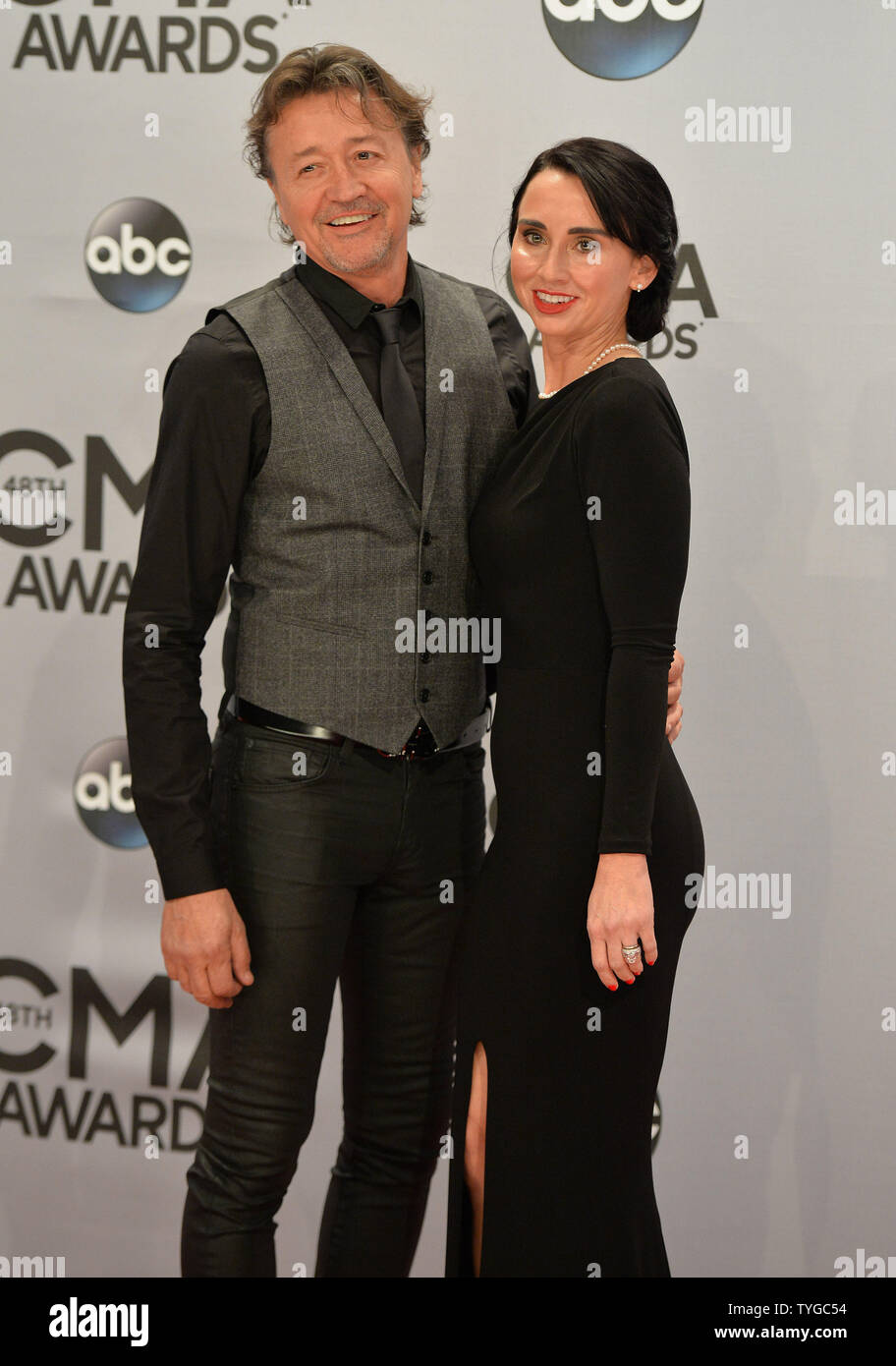 Mark Collie and guest arrive on the red carpet for the 48th Annual ...