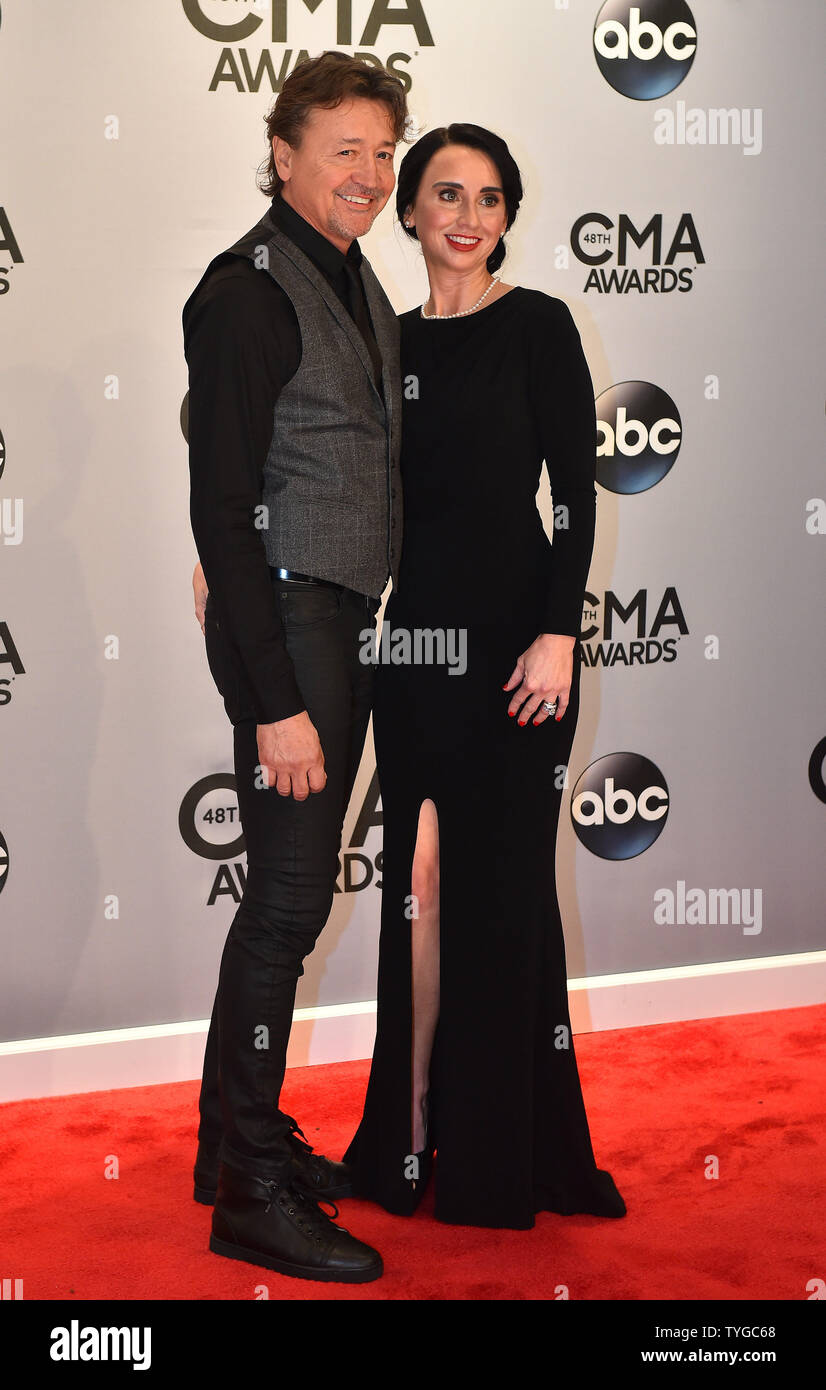 Mark Collie and guest arrive on the red carpet for the 48th Annual ...