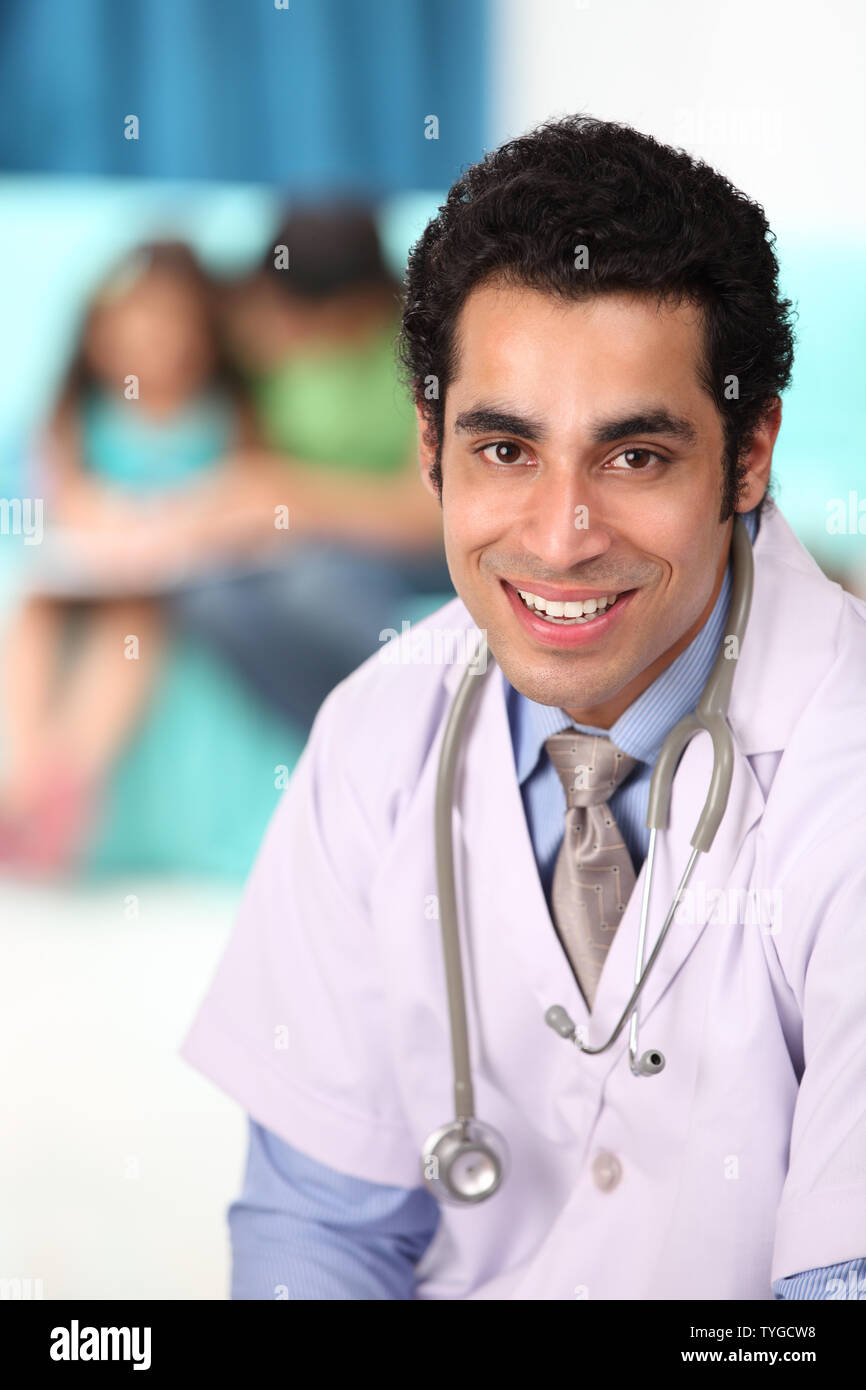 Portrait of a male doctor smiling Stock Photo - Alamy