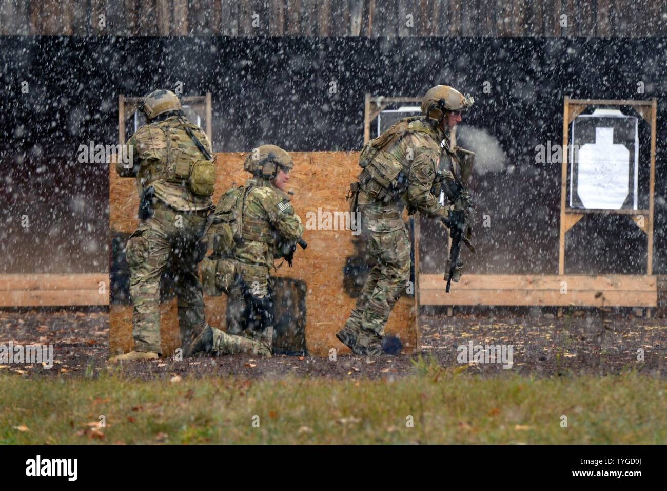 U.S. Soldiers assigned to 1-10th Special Forces Group maneuver through ...