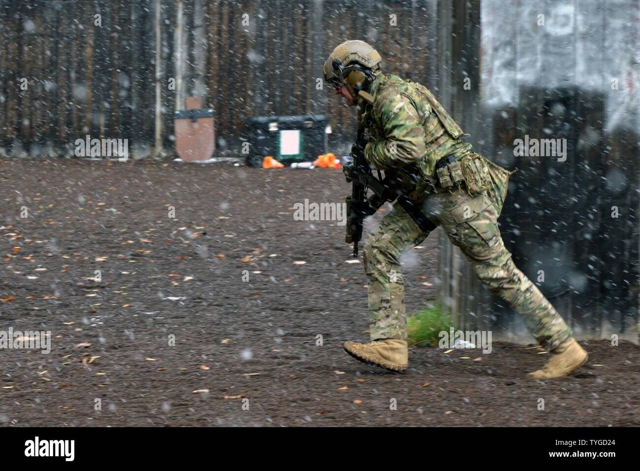 A U.S. Soldier assigned to 1-10th Special Forces Group maneuvers ...