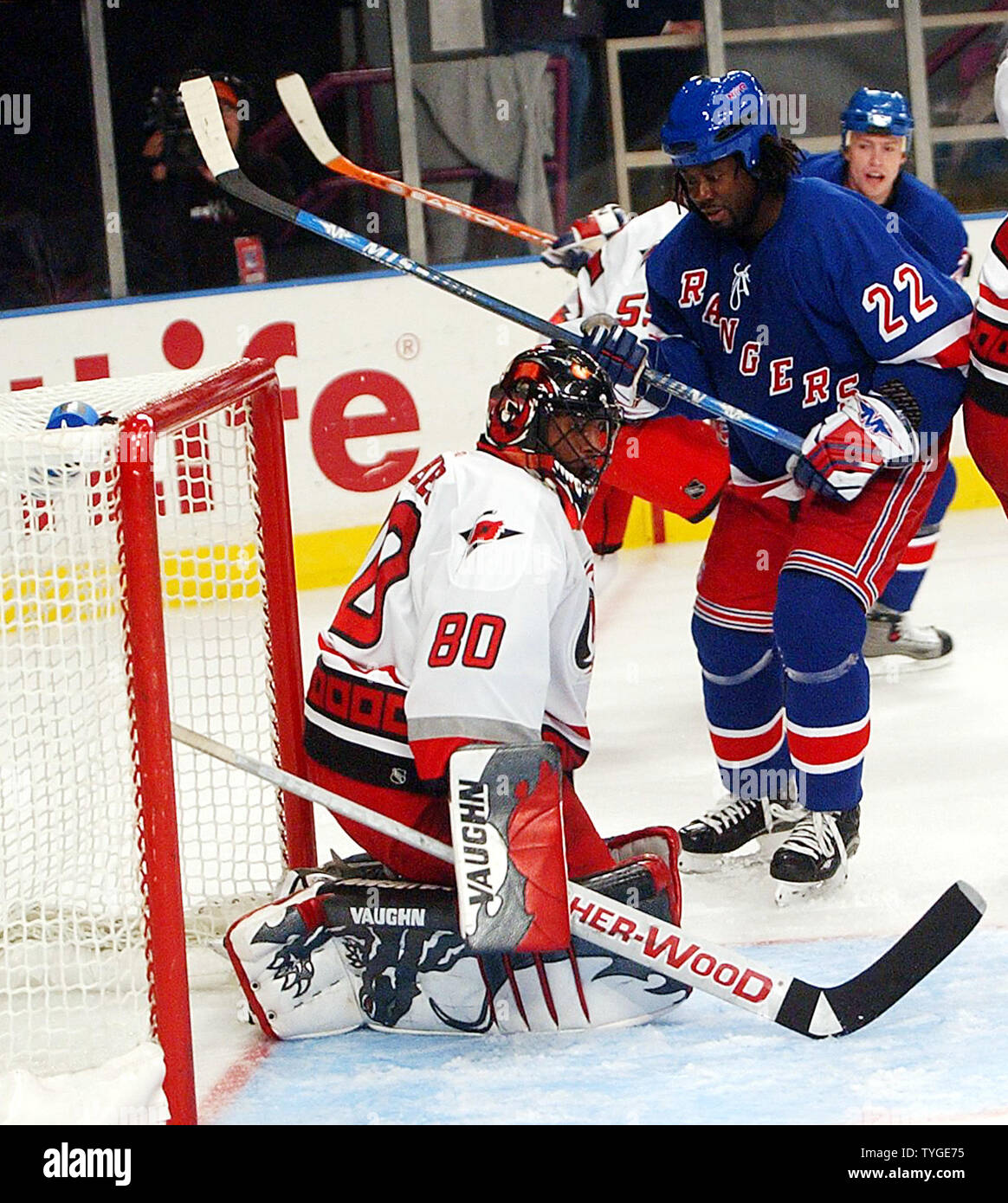 Carolina Hurricanes goalie #80 Kevin Weekes and New York Rangers #22 ...