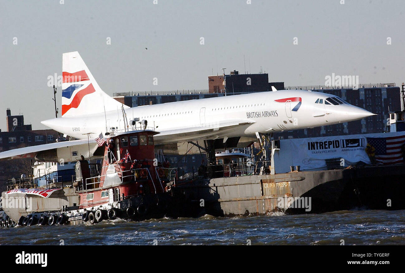 A river barge carries one of the preserved British Airways Concorde Jet ...