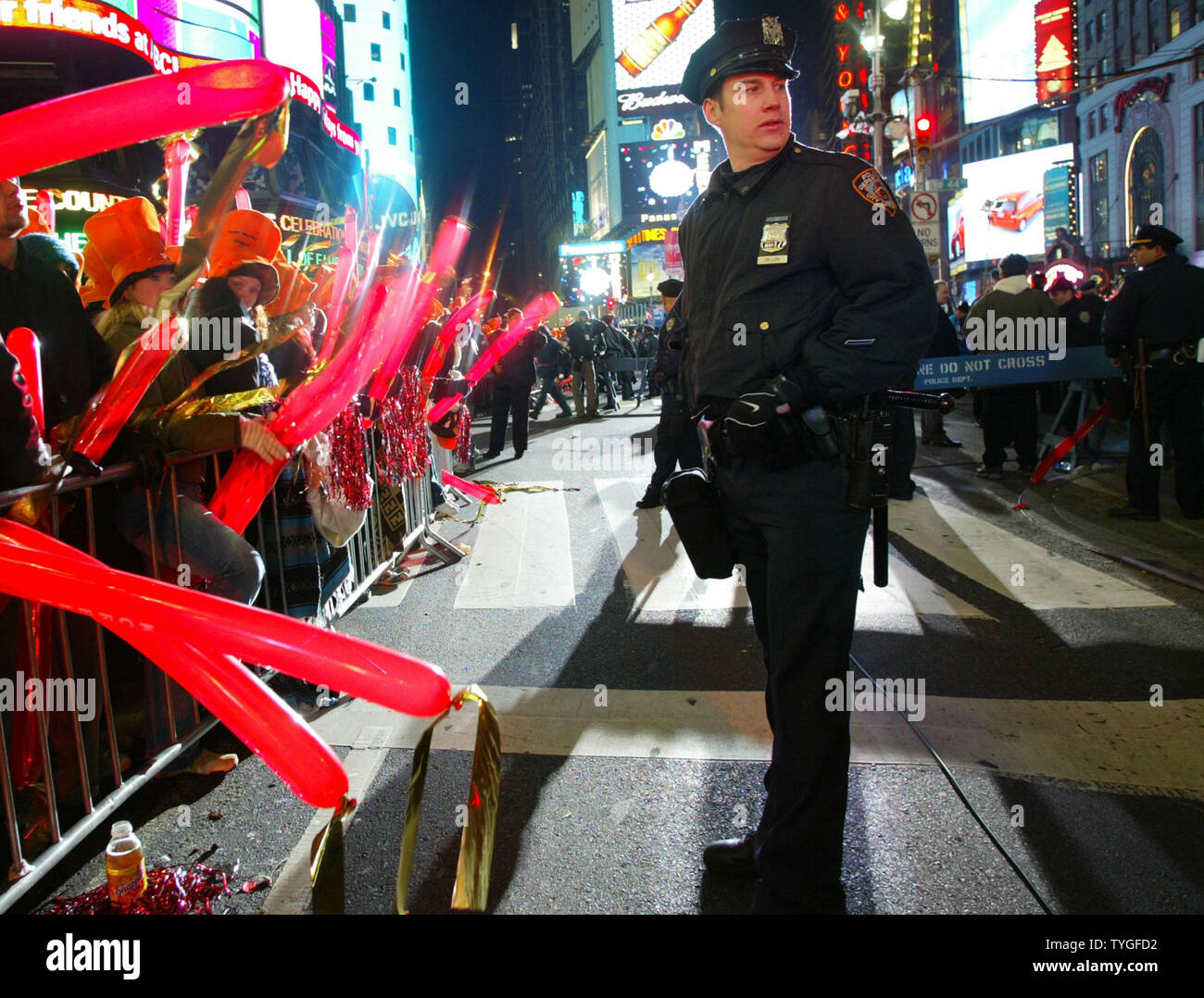 TIMES SQUARE NEW YEARS- A police oficer keeps guard as a half a million ...