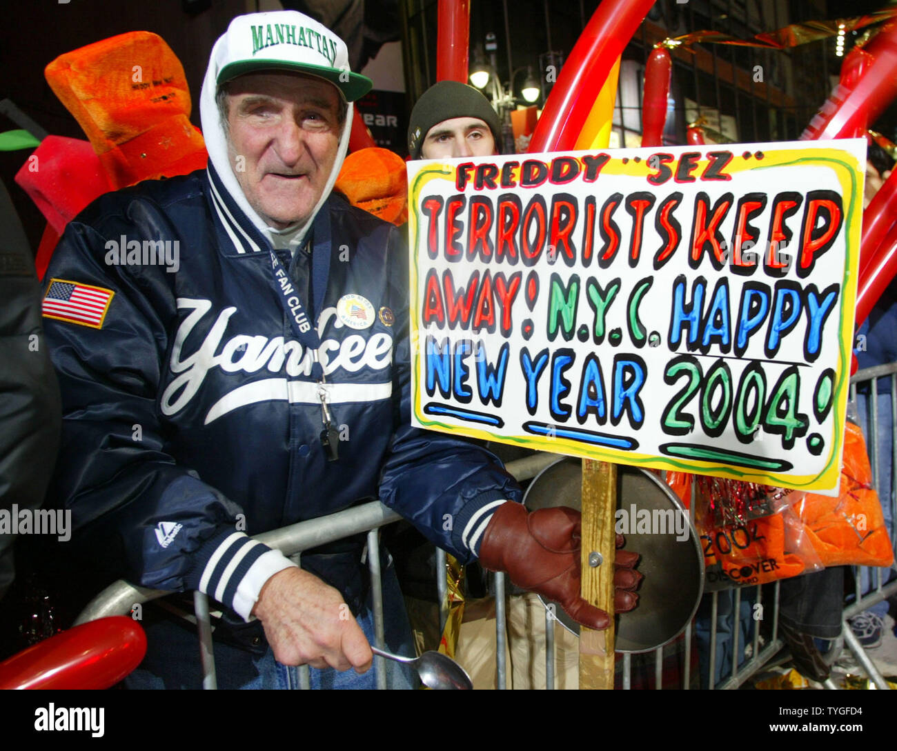TIMES SQUARE NEW YEARS- Fred Schulman displays his sign in Time Square ...