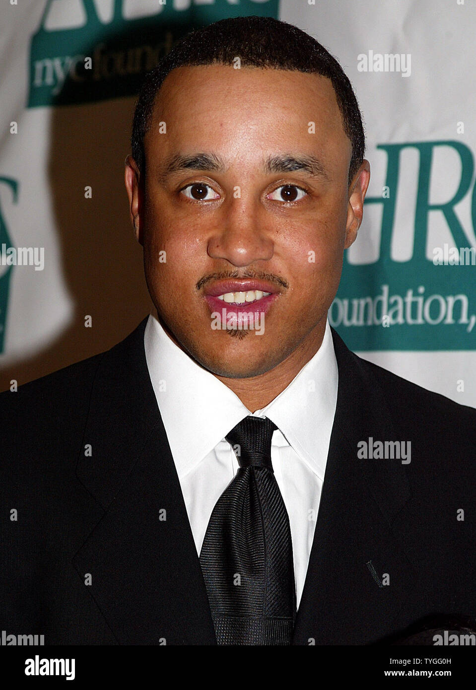 John Starks poses for pictures at a press conference prior to being ...