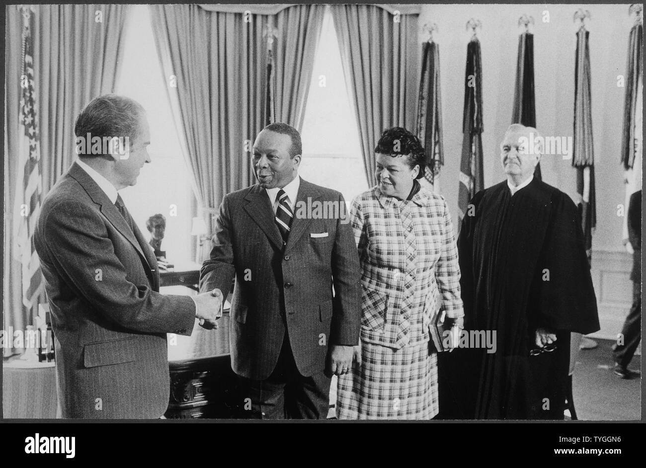 President Nixon shakes hands with Walter Washington after his being ...