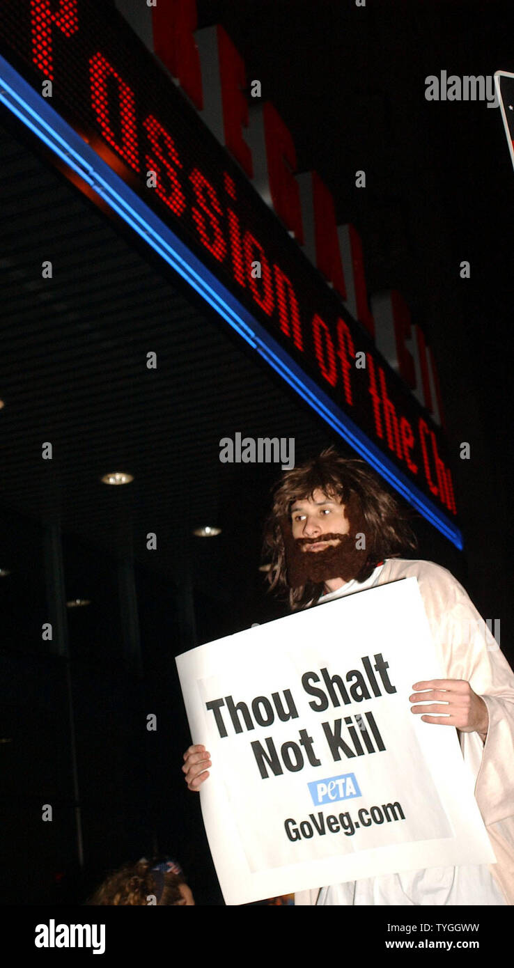 A member of PETA dressed like Jesus Christ bring their animal rights ...