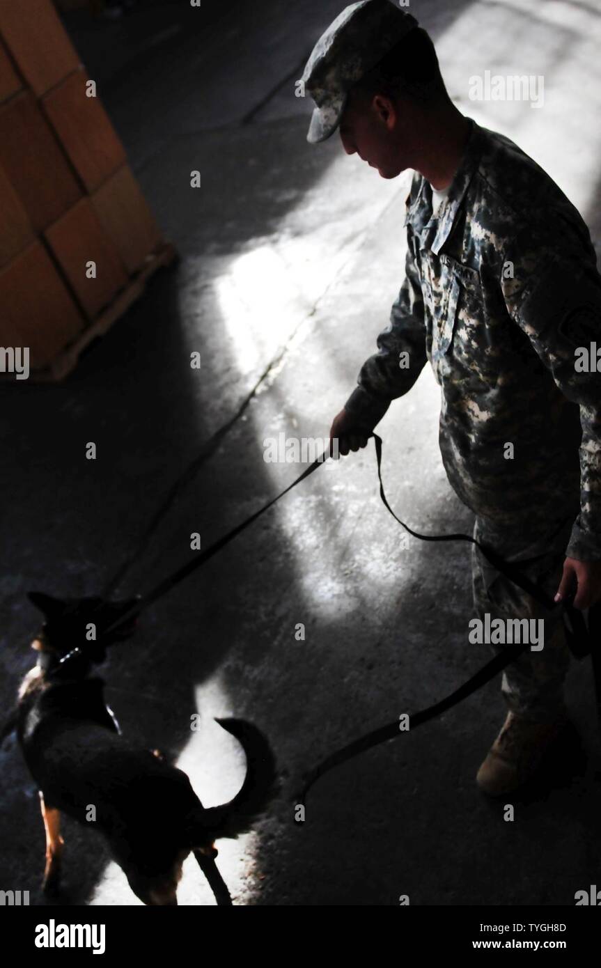 Pvt. Eric Smith, a military working dog handler, and Viola, a patrol ...