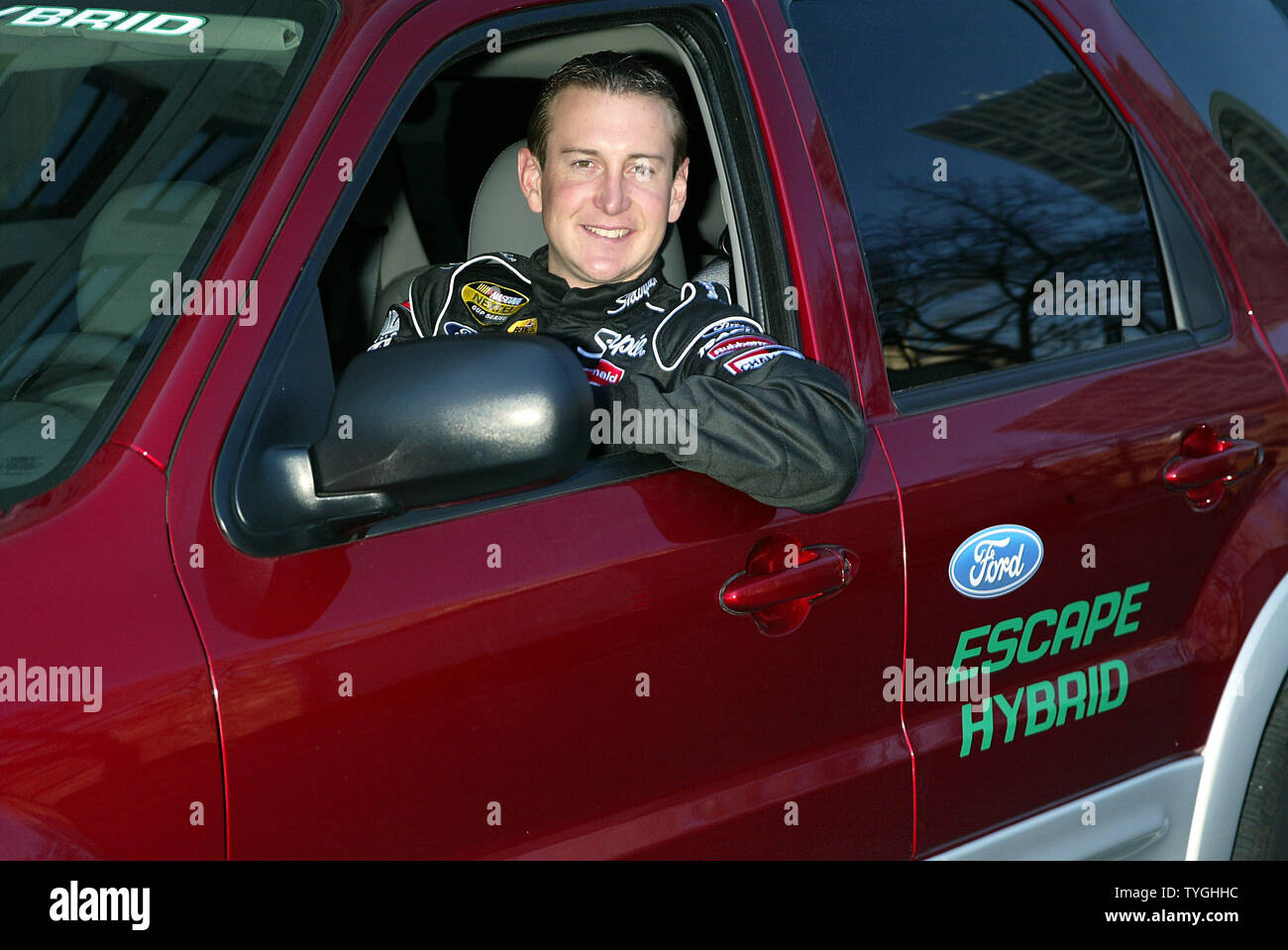 NASCAR Driver Kurt Busch poses with the new Ford Escape Hybrid Car in ...