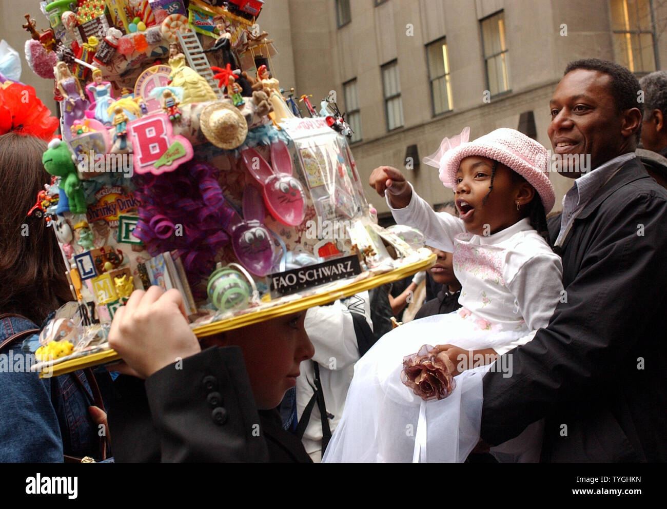 A young girl admires a unique easter hat outside of St. Patrick ...