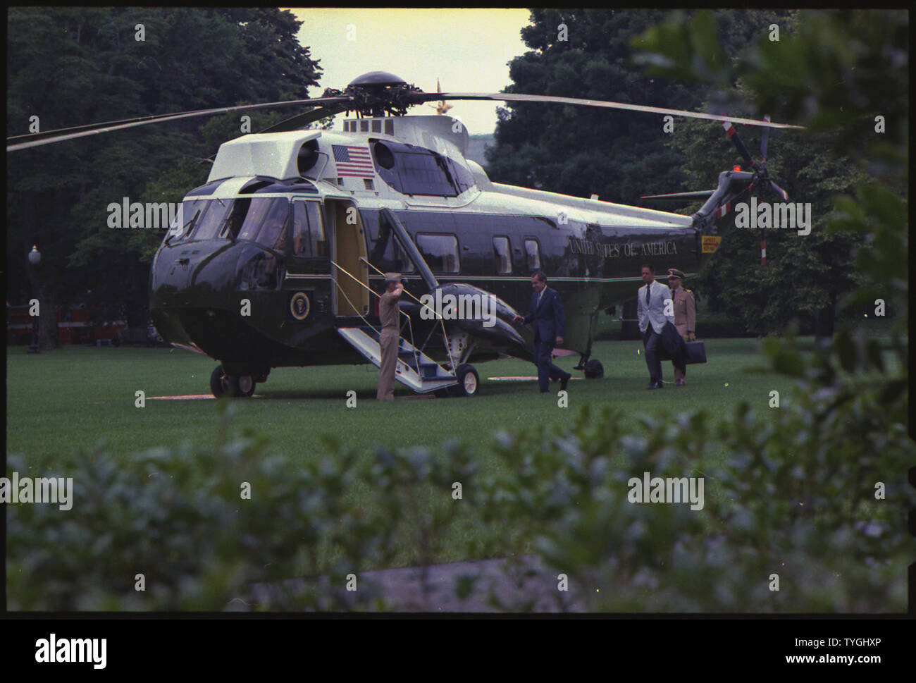 President Nixon, H.R. Haldeman, and military aide boarding Marine One ...