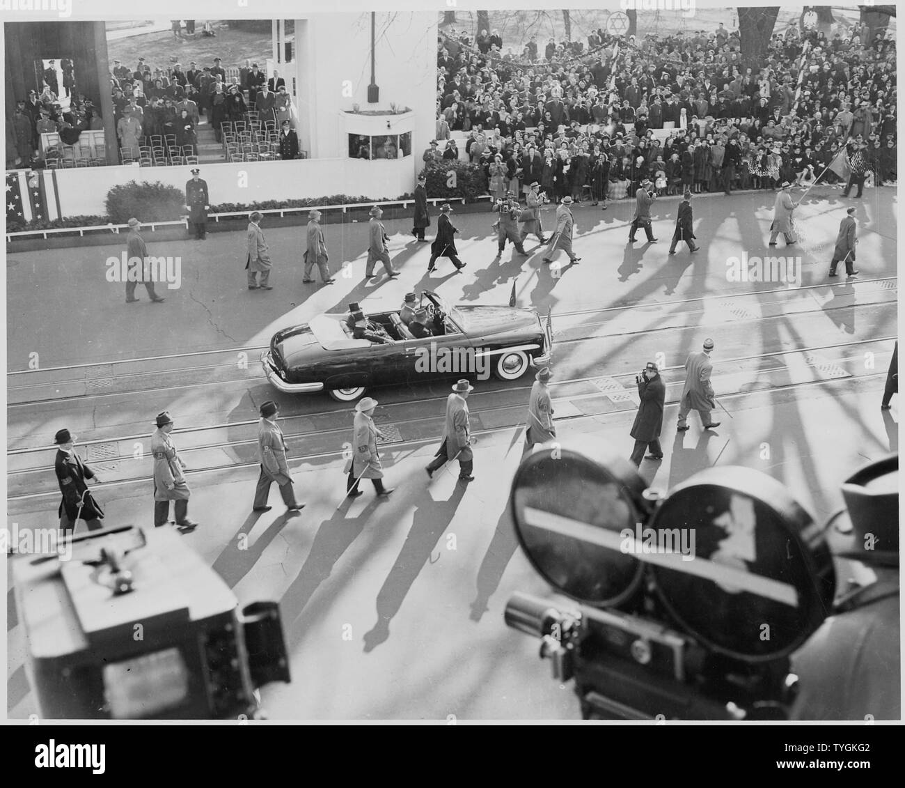 President Truman and Vice President Alben Barkley ride in a limousine ...