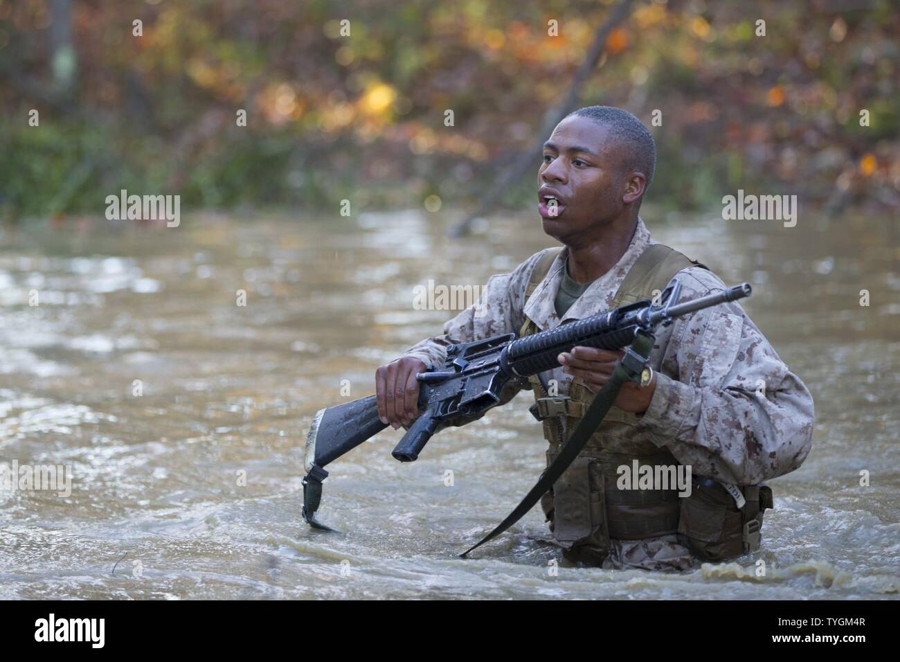 A U.S. Marine candidate with Officer Candidate School (OCS) maneuvers ...
