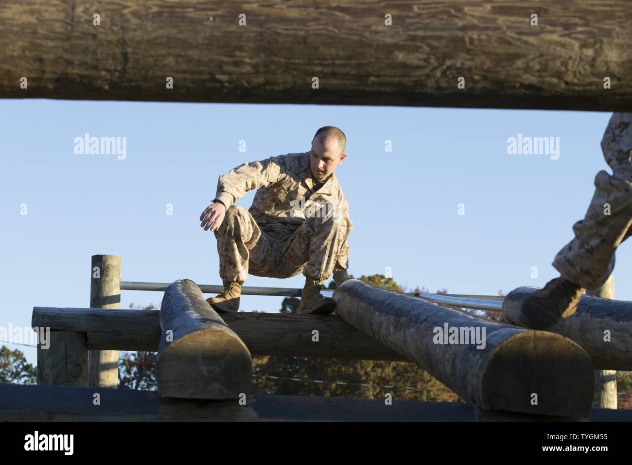 A U.S. Marine candidate with Officer Candidate School (OCS) balances on ...