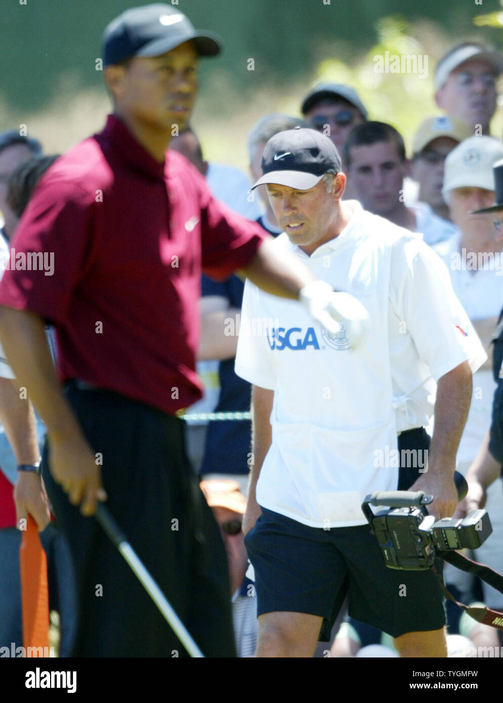 Tiger Woods Caddie Steve Williams grabs a camera from a fan on the 2nd ...