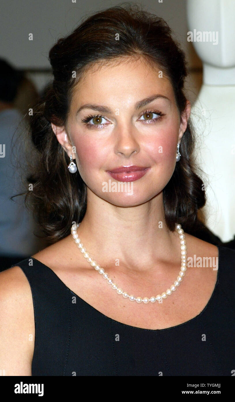 Ashley Judd poses for pictures at the unveiling of Armani fashions ...