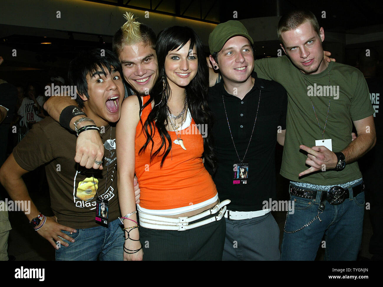 Ashlee Simpson poses with her band before signing copies of her new CD ...