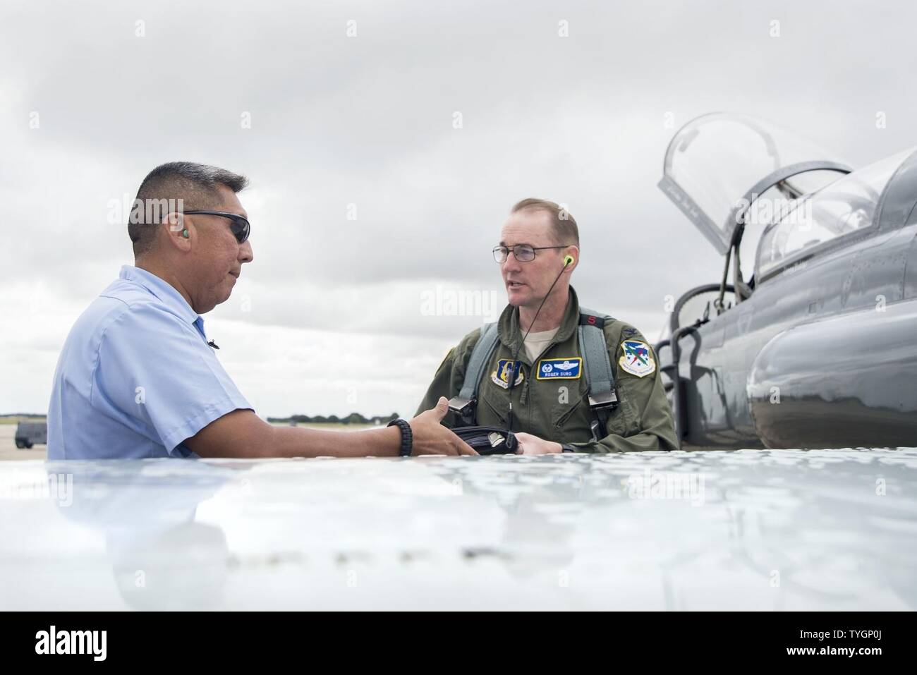 Col. Roger Suro (right), 340th Flying Training Group commander, hands ...