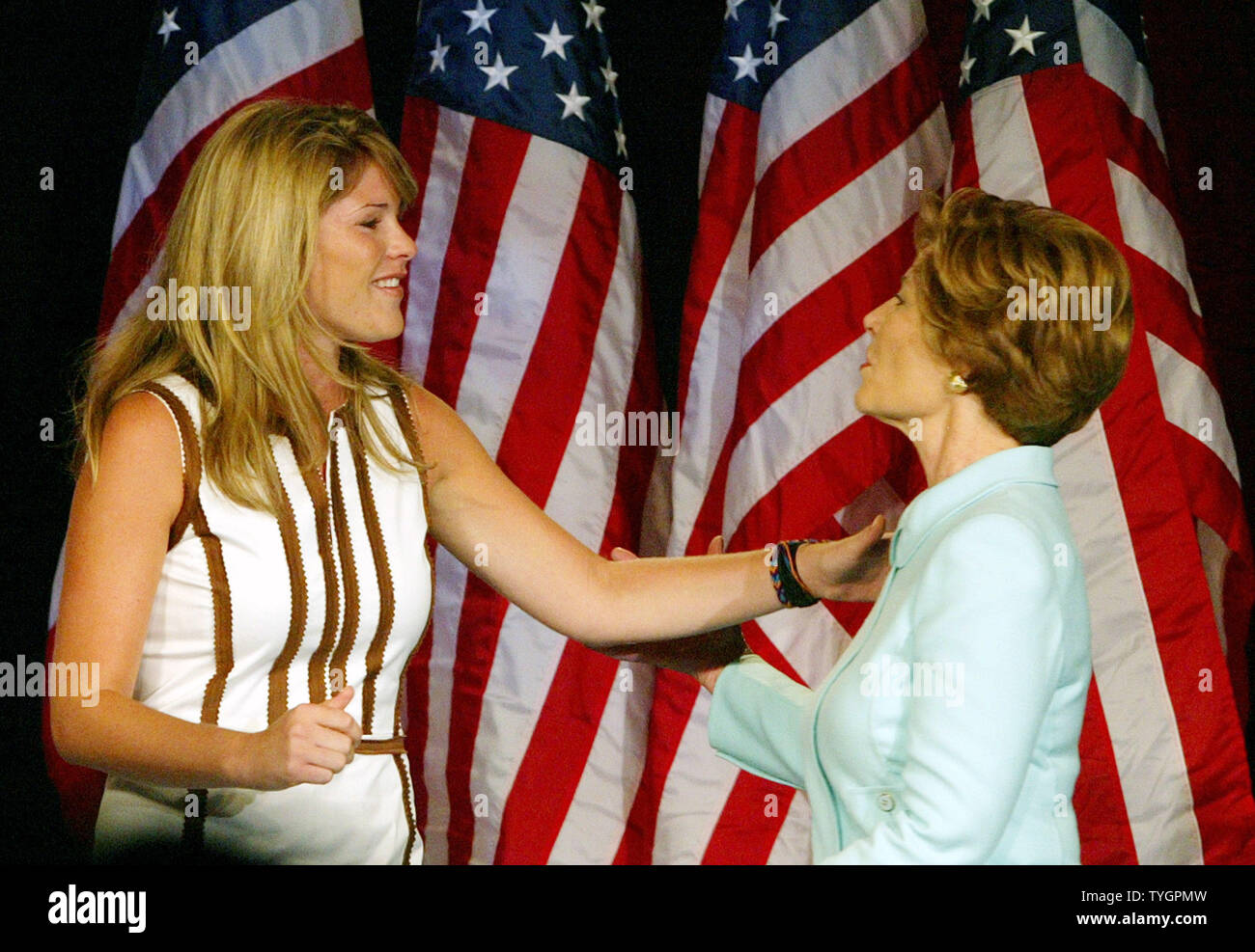 First Lady Laura Bush (R) is greeted on stage by daughter Jenna at the ...