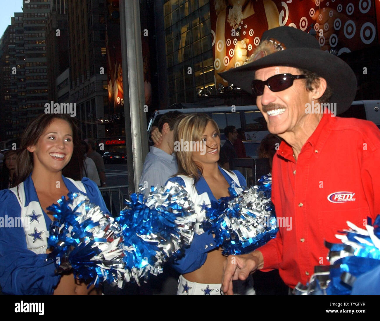 NASCAR legend Richard Petty is greeted by Dallas Cowboy cheer leaders ...