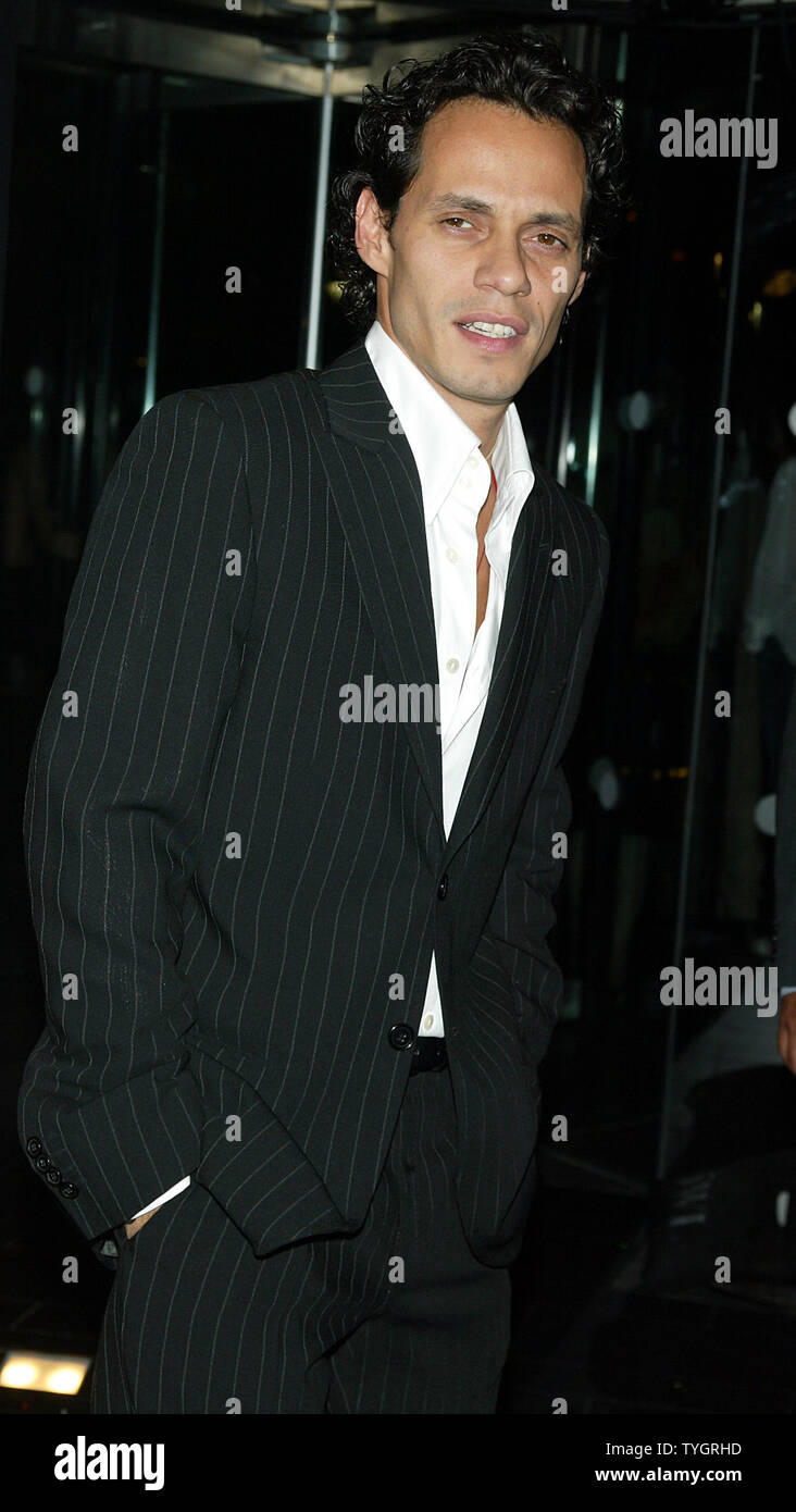 Marc Anthony poses for pictures at the Coty 100th Anniversary ...